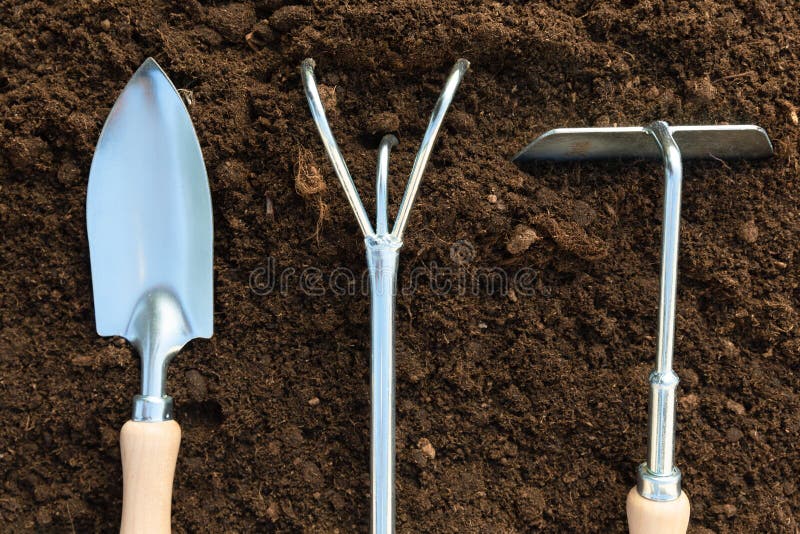 Gardening Tools on Soil Background. Spring Garden Work Concept Stock ...