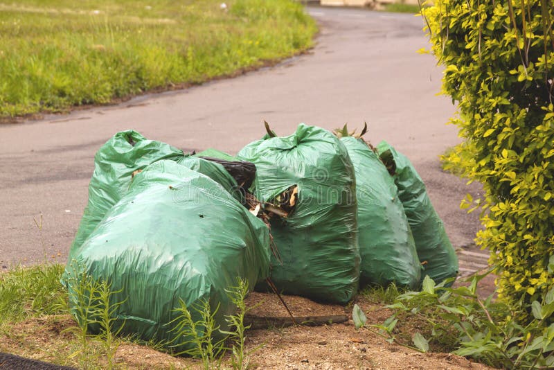 Gargbage Bags Waiting for Collectionon Side of Road Stock Photo - Image ...