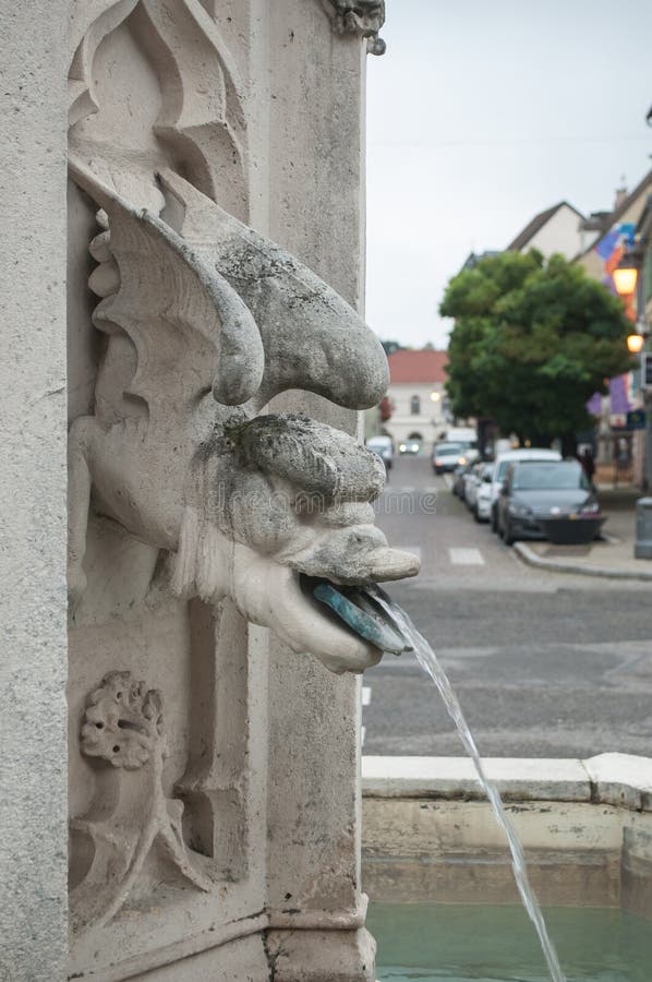 Gargoyle in a Fountain Spitting Water by Mouth Stock Photo - Image of ...