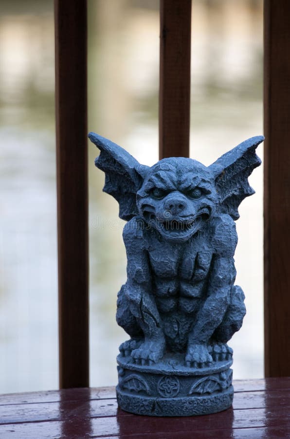 Gargoyle sitting watch stock photo. Image of monument - 283090520