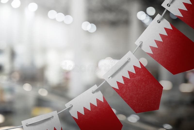A Garland of Bahrain National Flags on an Abstract Blurred Background ...