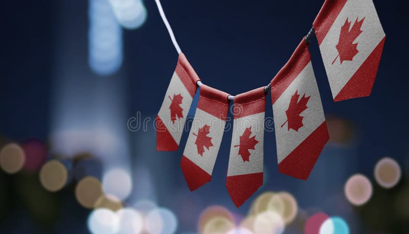 A Garland of Canada National Flags on an Abstract Blurred Background ...