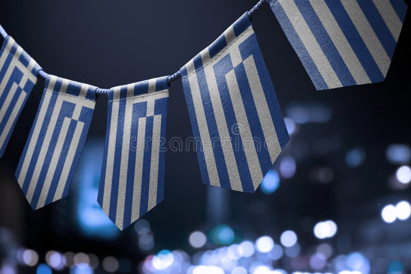 A Garland of Greece National Flags on an Abstract Blurred Background ...