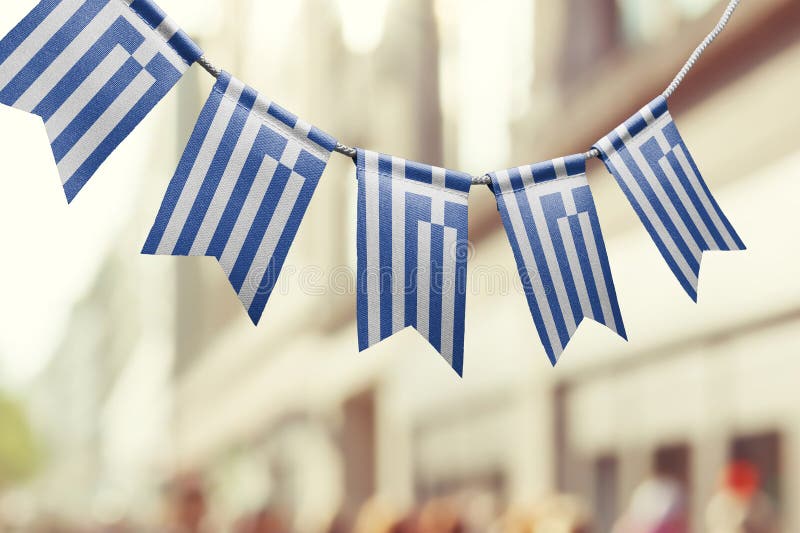 A Garland of Greece National Flags on an Abstract Blurred Background ...