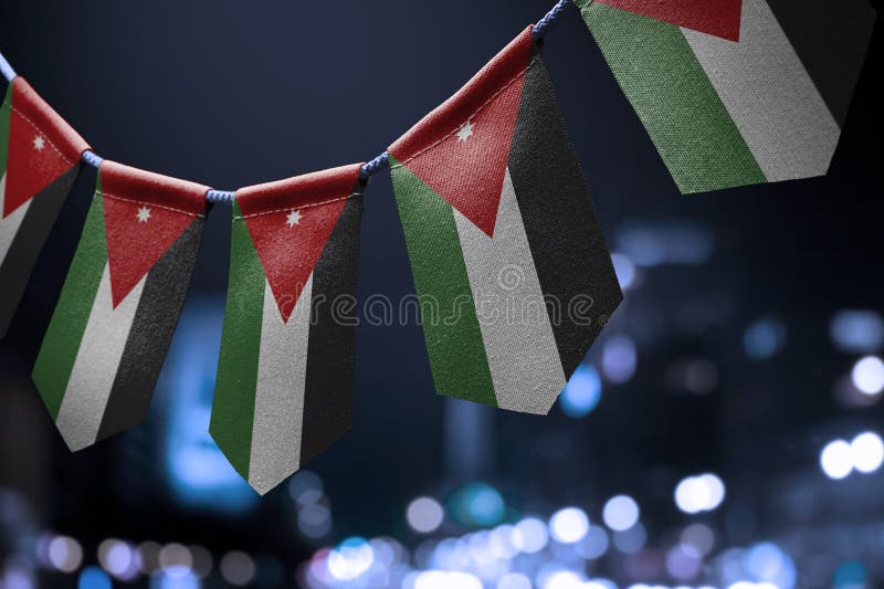 A Garland of Jordan National Flags on an Abstract Blurred Background ...