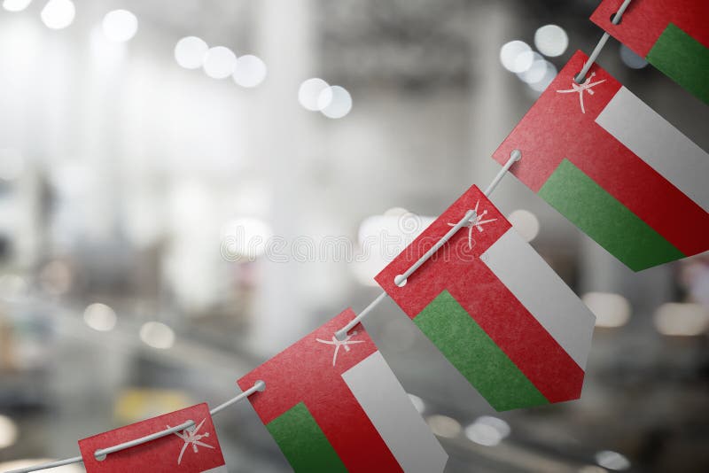 A Garland of Oman National Flags on an Abstract Blurred Background ...