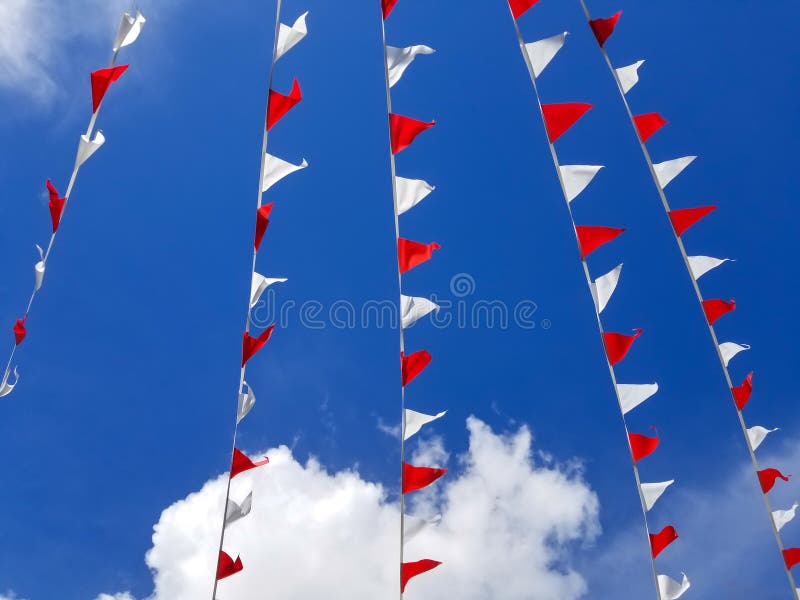 Garland of Red and White Triangle Flags on Blue Sky Background Stock ...