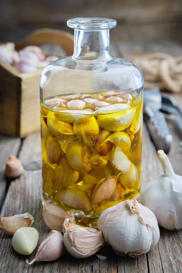 Garlic Aromatic Flavored Oil or Infusion Bottle and Garlic Cloves Stock ...