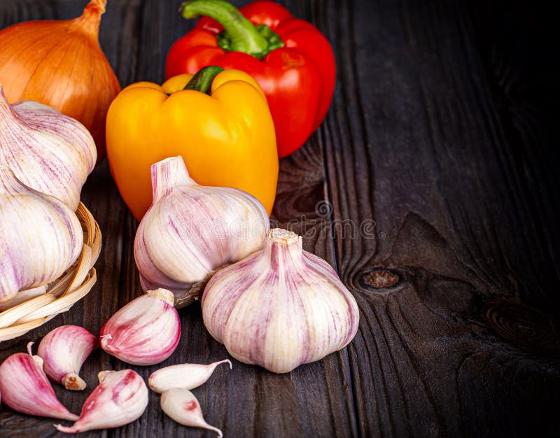 Garlic and Bell Pepper on a Wooden Table Stock Image - Image of garlic ...