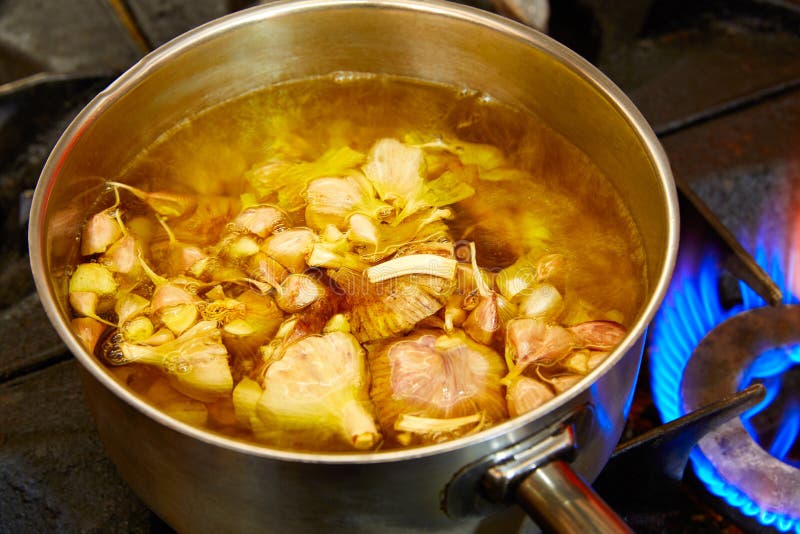 Garlic Boiling Soup in a Pan Stock Photo - Image of garlic, gourmet ...
