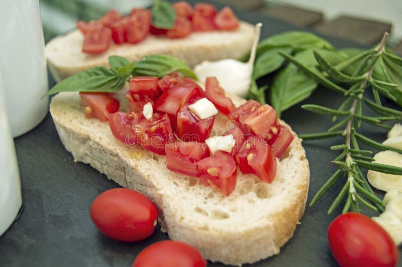 Garlic Bread Bruschetta with Cherry Tomatoes and Ingredients Stock ...