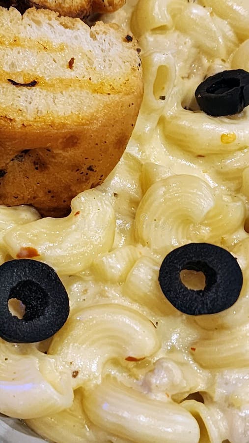 Garlic Bread and Chicken Pasta Stock Image - Image of pasta, olives ...