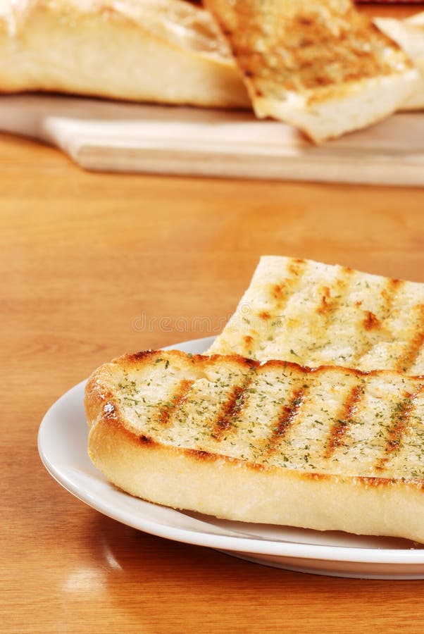Garlic bread on a plate stock image. Image of crunchy - 13377459