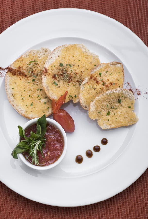 Garlic Bread Served in a Restaurant 6top View Stock Image - Image of ...