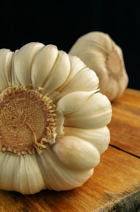 Garlic Bulb on a Kitchen Board. Stock Photo - Image of material ...