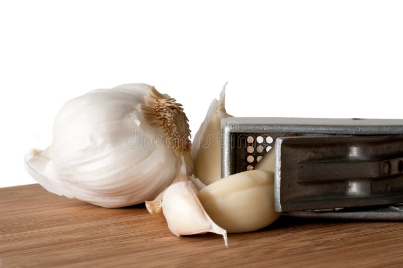 Garlic Bulb and Press stock photo. Image of metal, flavoring - 13203704