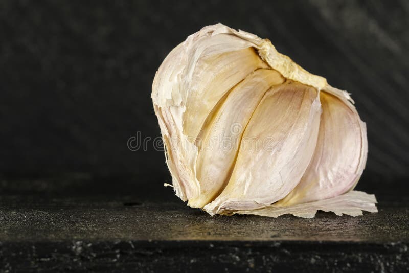 Garlic bulb split open stock photo. Image of flavor - 125138920