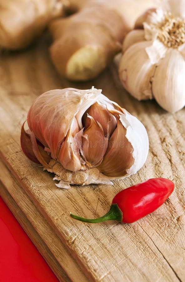 Garlic Bulbs, Chilli Pepper and Ginger Stock Photo - Image of surface ...