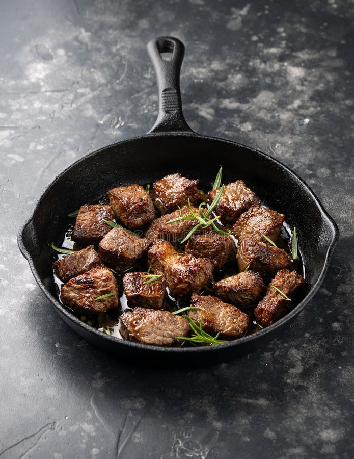 Garlic Butter Beef Steak Bites in Iron Cast Pan Stock Photo - Image of ...