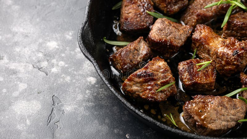 Garlic Butter Beef Steak Bites in Iron Cast Pan Stock Photo - Image of ...