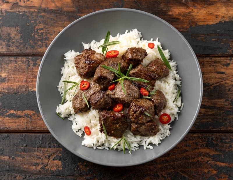 Garlic Butter Beef Steak Bites with Rice Stock Photo - Image of stew ...