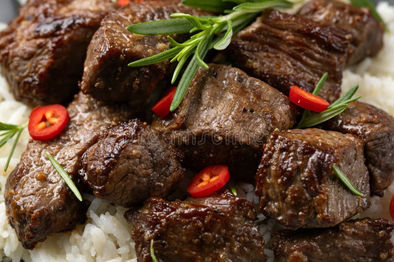 Garlic Butter Beef Steak Bites with Rice Stock Image - Image of cooked ...