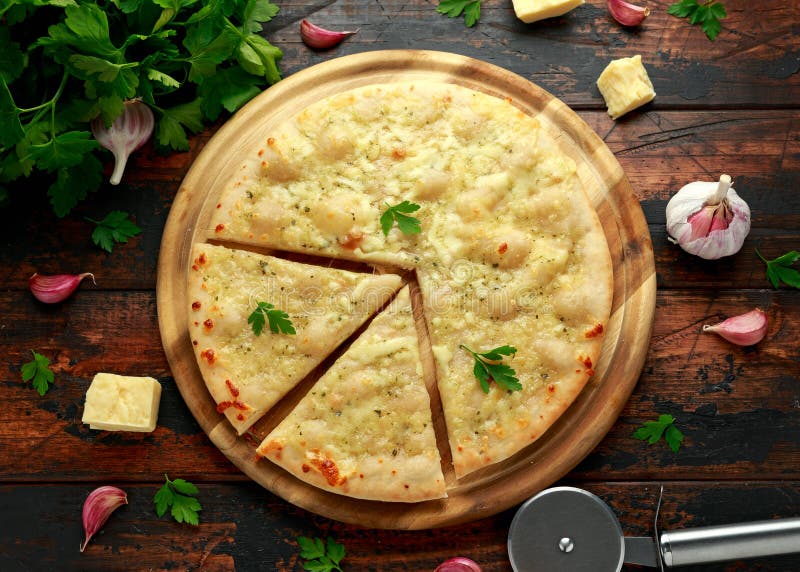 Garlic Cheese Pizza on Wooden Board with Herbs Stock Image - Image of ...