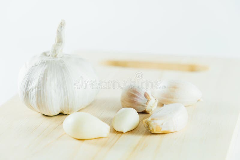 Garlic on chopping block stock image. Image of vegetable - 56721371