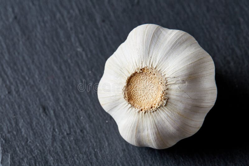 Garlic Close Up on Wooden Plate on Black Board,shallow Depth of Field ...