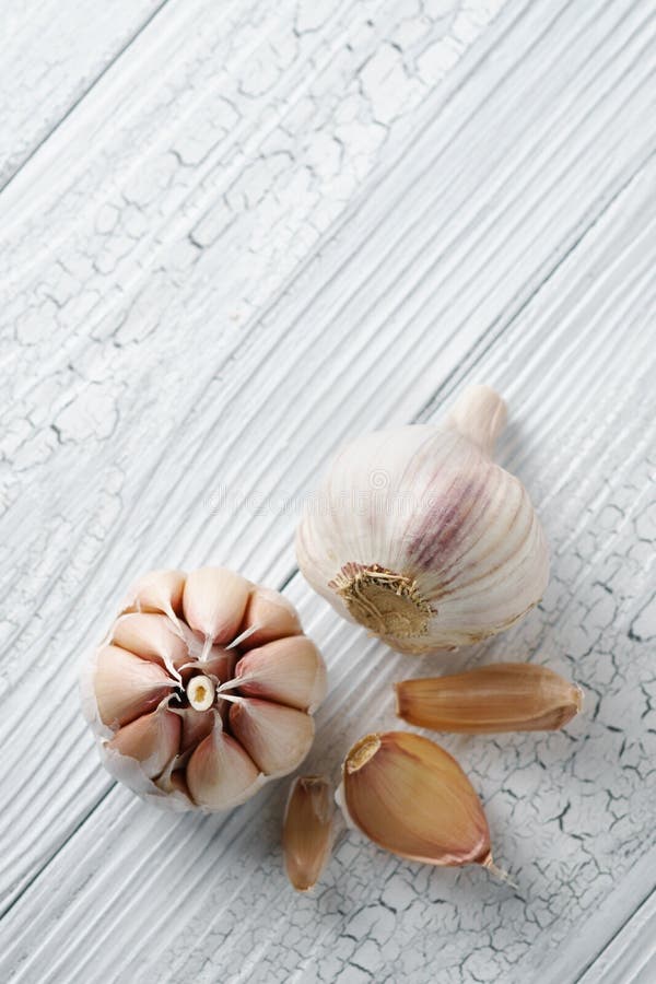Garlic and Garlic Cloves on White Wooden Table Stock Photo - Image of ...