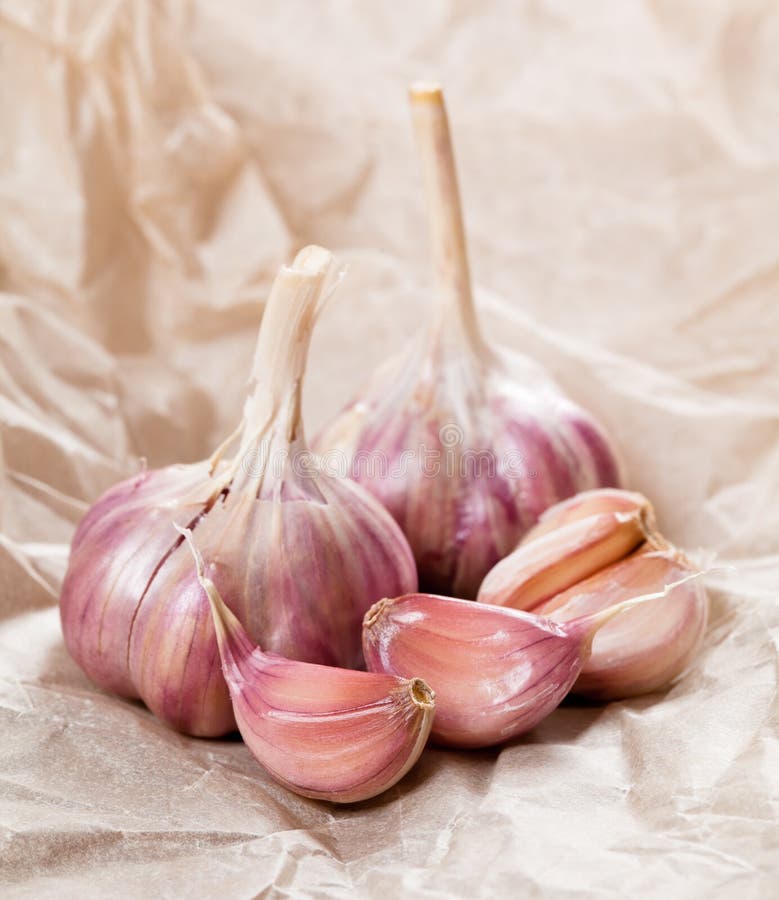 Garlic on a Crumpled Wrapping Paper Stock Image - Image of green ...
