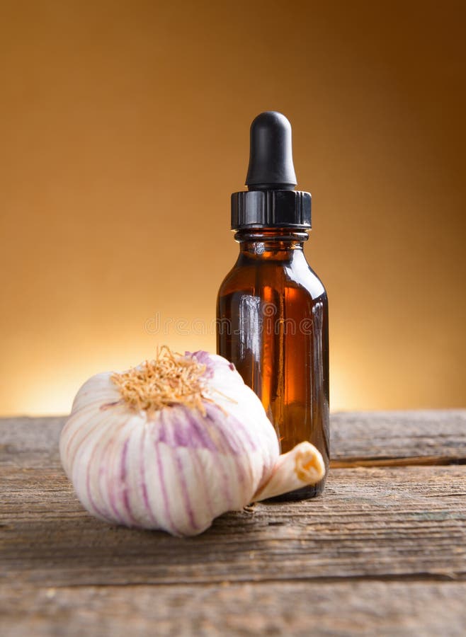 Garlic extract stock image. Image of olive, liquid, bottle - 41213101