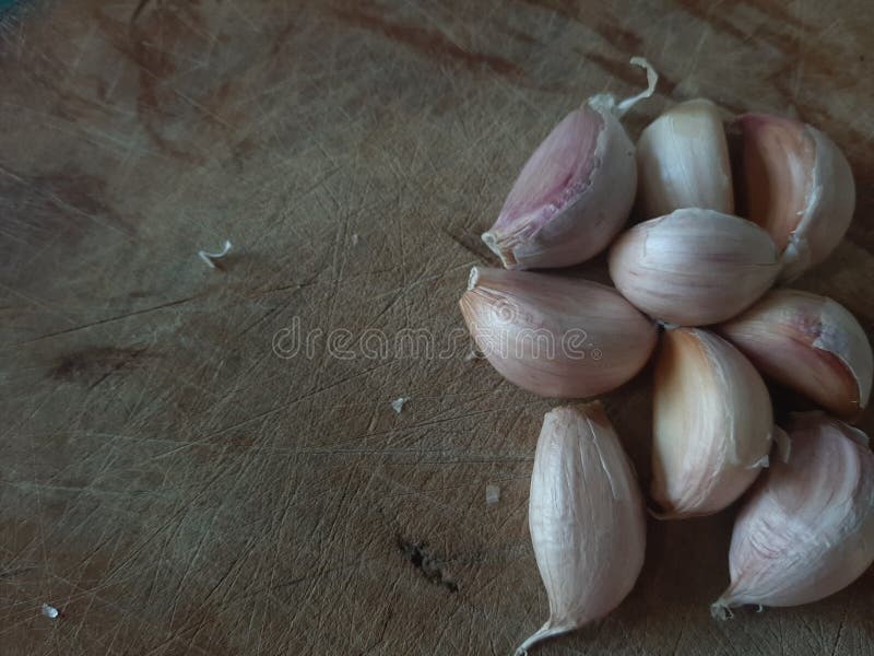 Garlic Fresh Ground on Wooden Cutting Board. Stock Image - Image of ...