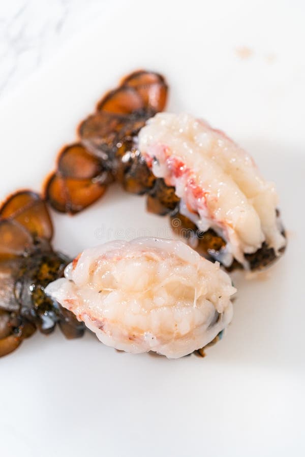 Garlic lobster tails stock photo. Image of preparing - 261583314