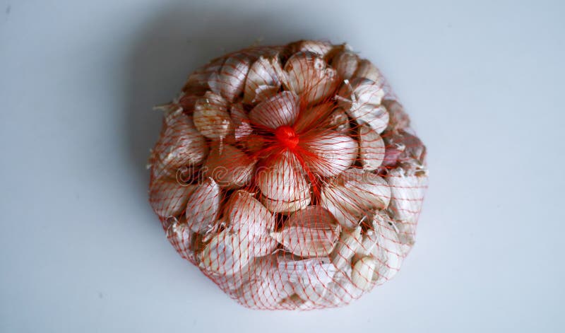 Garlic in a mesh bag stock photo. Image of chinese, food - 156680984
