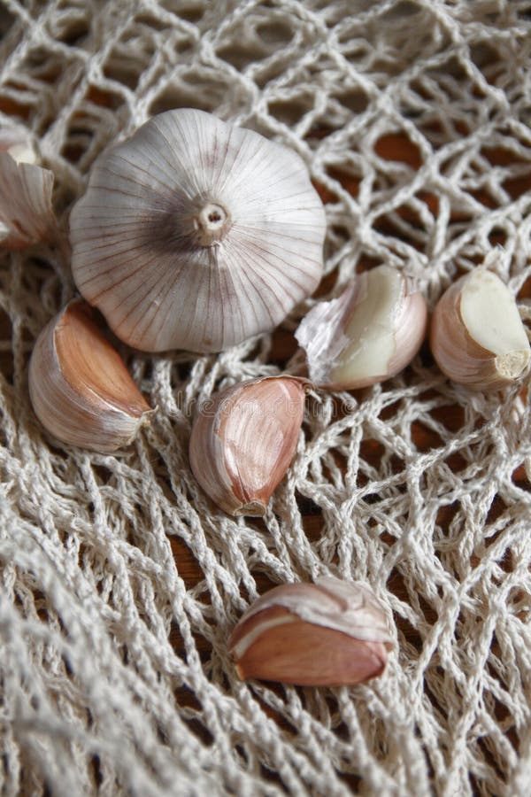 Garlic on a white net stock image. Image of garlic, grocery - 315498069