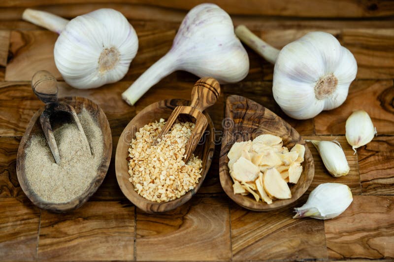 Garlic on olivewood stock image. Image of powder, allium - 330549507