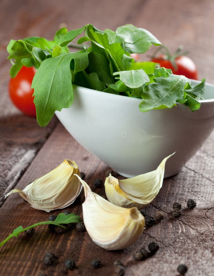 Garlic and pepper stock image. Image of arugula, bowl - 17430339