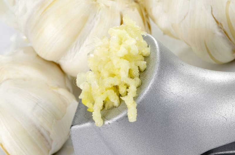 Garlic Press with Fresh Garlic Stock Image - Image of pressed, tool ...