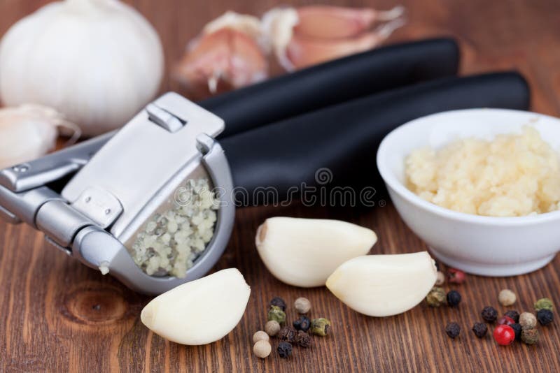 Garlic press and garlic stock image. Image of food, tool - 33560263