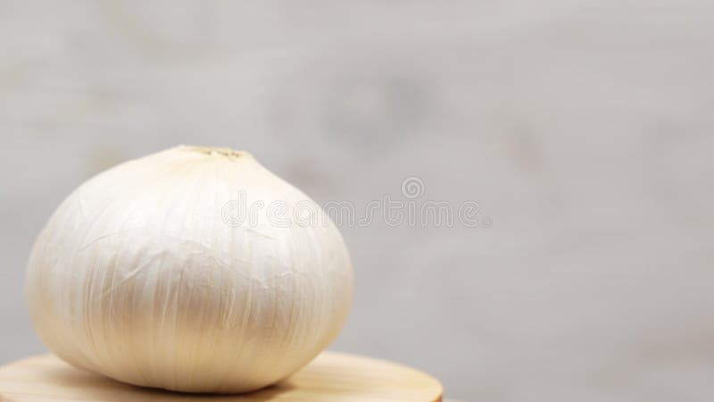 Garlic Sits on a Wooden Surface. Stock Video - Video of harvest, round ...