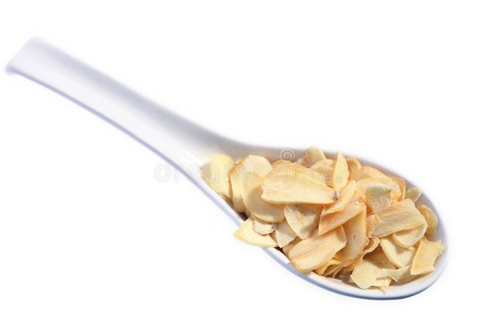 Garlic slices on a spoon stock photo. Image of dried - 11768696