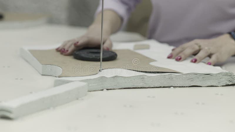Garment Fabric Cutting is Done in a Workshop Using Hands and Tools with ...