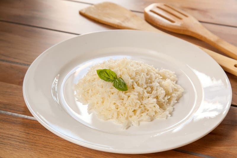 Garnish Rice Boiled with Basil on the Plate. European Cuisine Stock ...