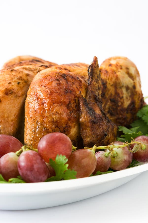 Garnished Roasted Turkey with Grapes and Herbs on White Background ...
