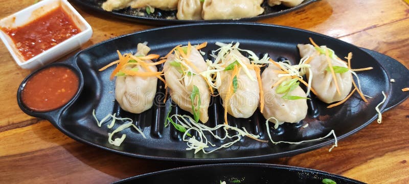 Garnished Steam Paneer Momos in Cafe Stock Photo - Image of paneer ...