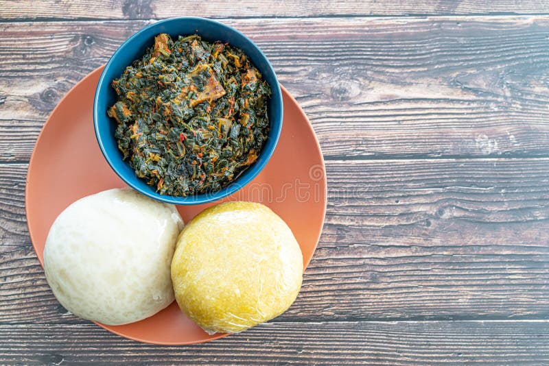 Garri and Pounded Yam Served with Efo Riro Vegetable Soup Stock Photo ...