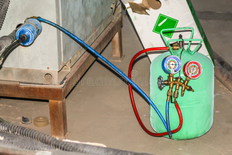 Gas is Being Refiling into the Heavy Ac Compressor of Central Air ...