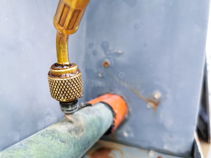 Gas is Being Refiling into the Heavy Ac Compressor of Central Air ...