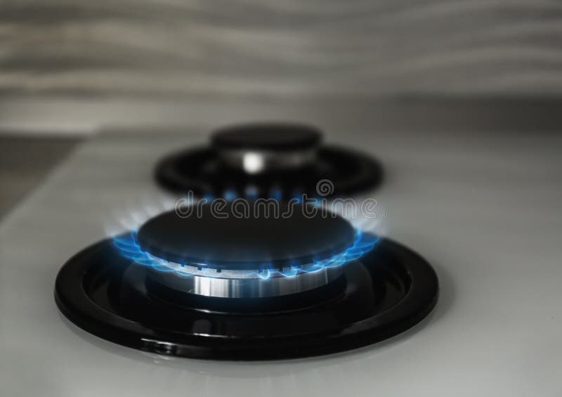 Gas Burner of Modern Stove with Burning Blue Flame, Top View Stock ...